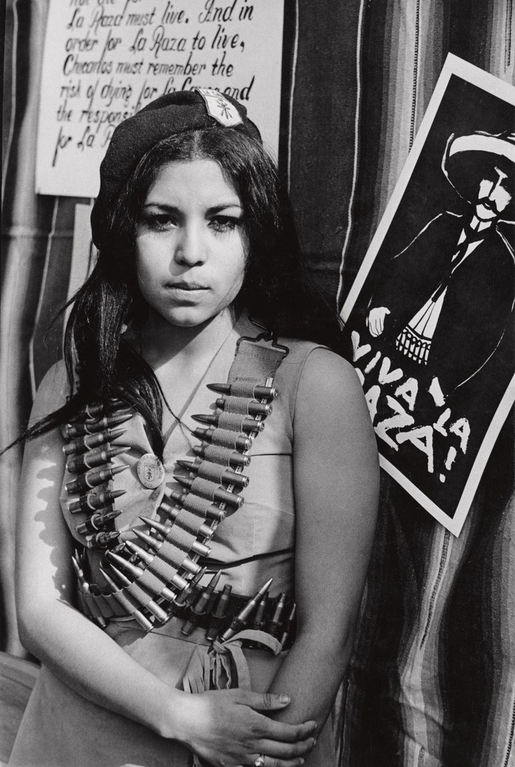 A woman in Las Adelitas de Aztlán, a women’s organization that ...